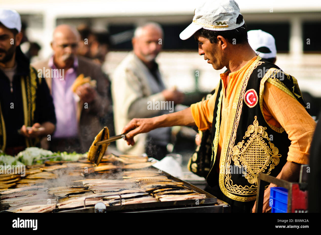 ISTANBUL, Turkey — ISTANBUL, Turkey — Cooking fish on an open grill on ...