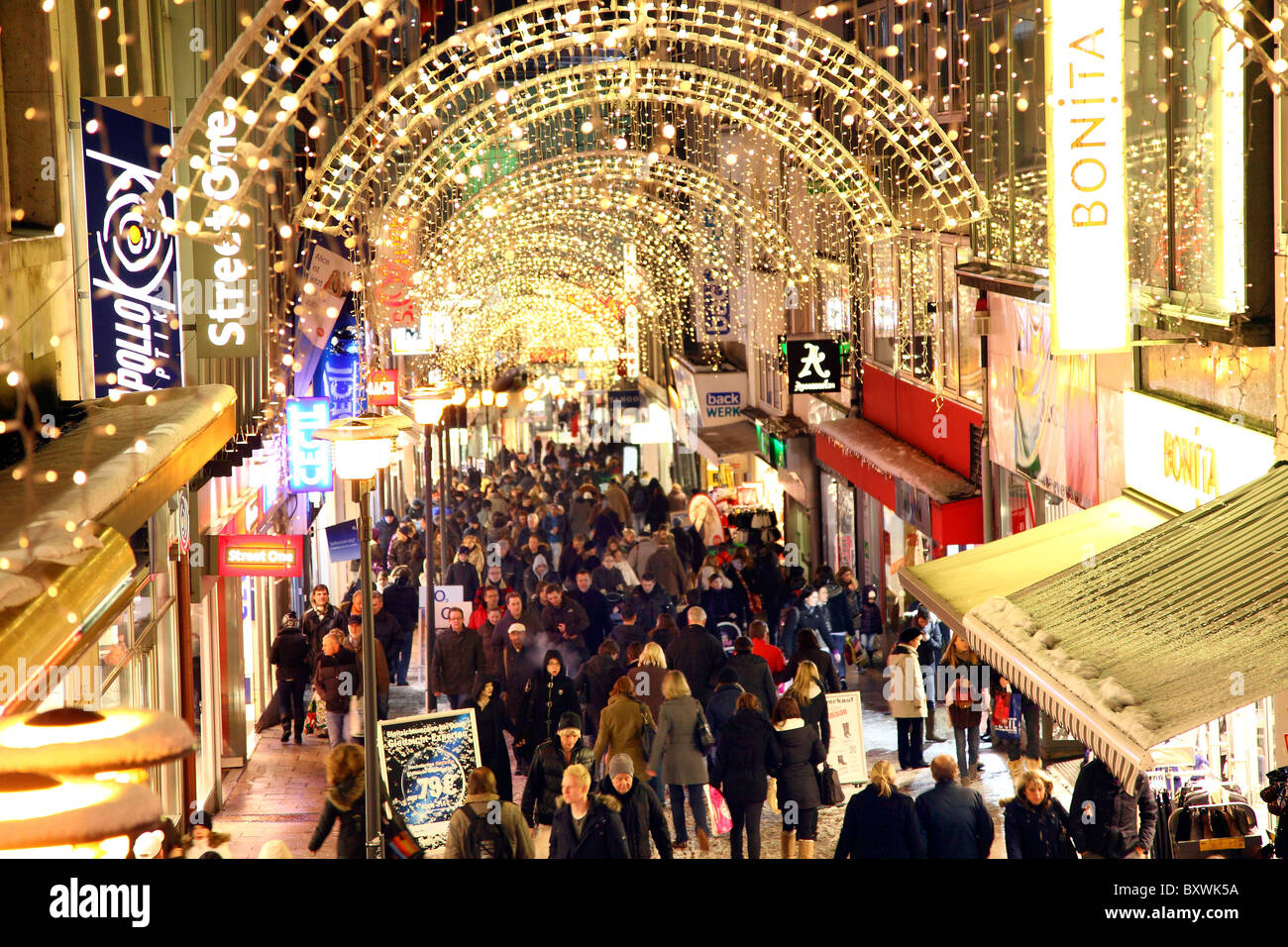 Shopping street, pedestrian area, illumination, people going shopping ...