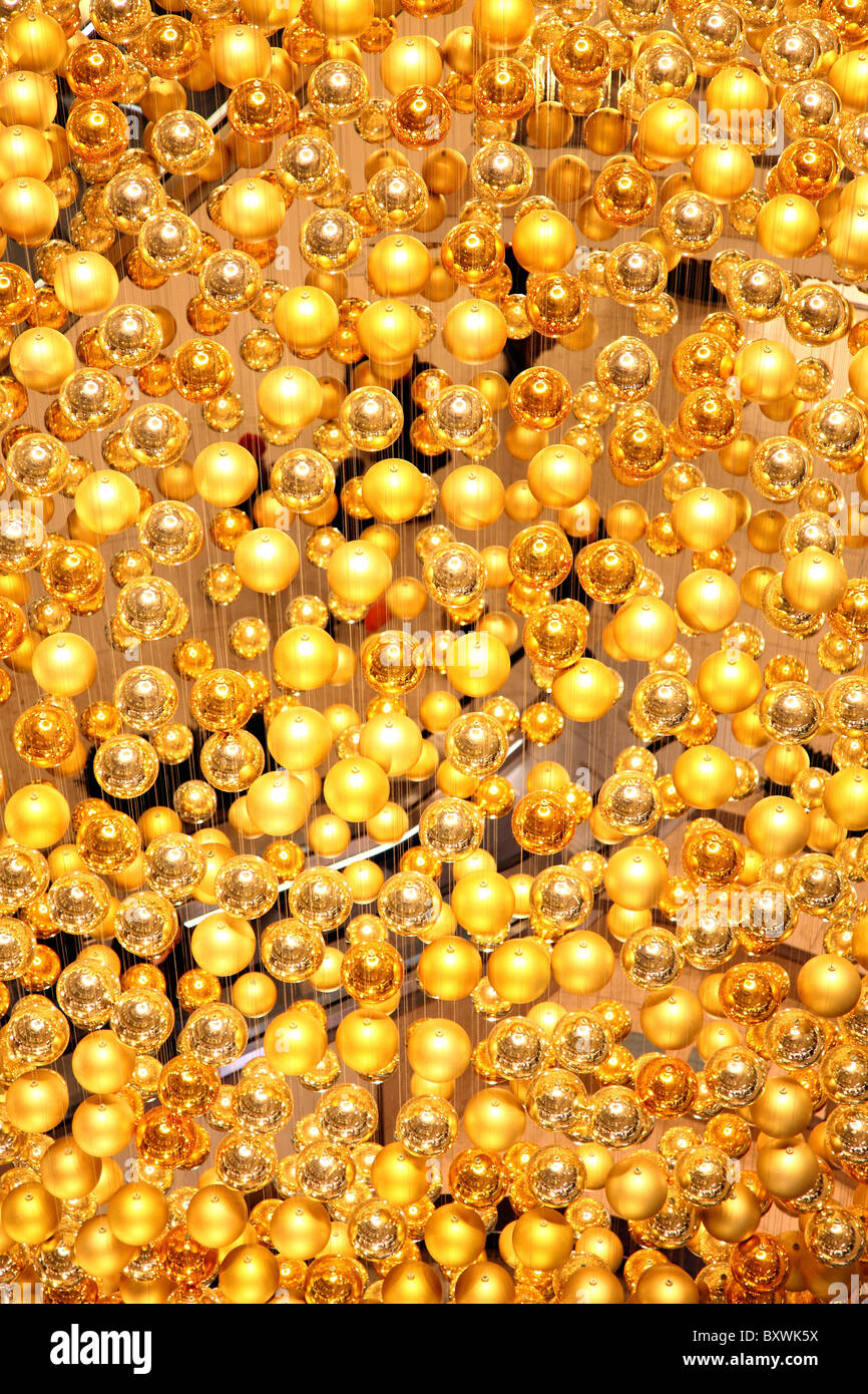Christmas decoration in a shopping mall. Many golden Christmas tree ...