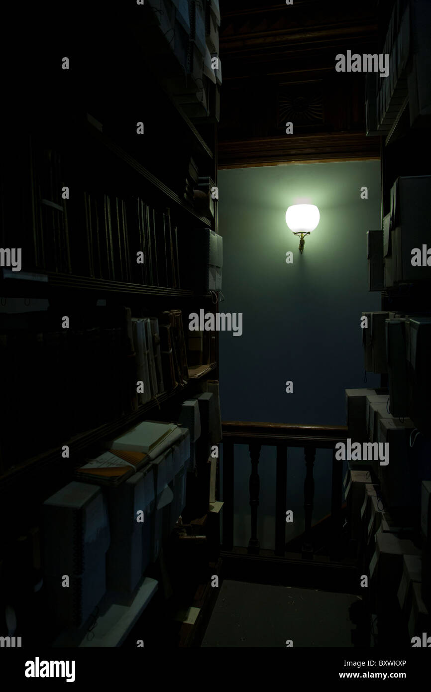 interior of library, book stacks, book shelves, dark, mysterious ...