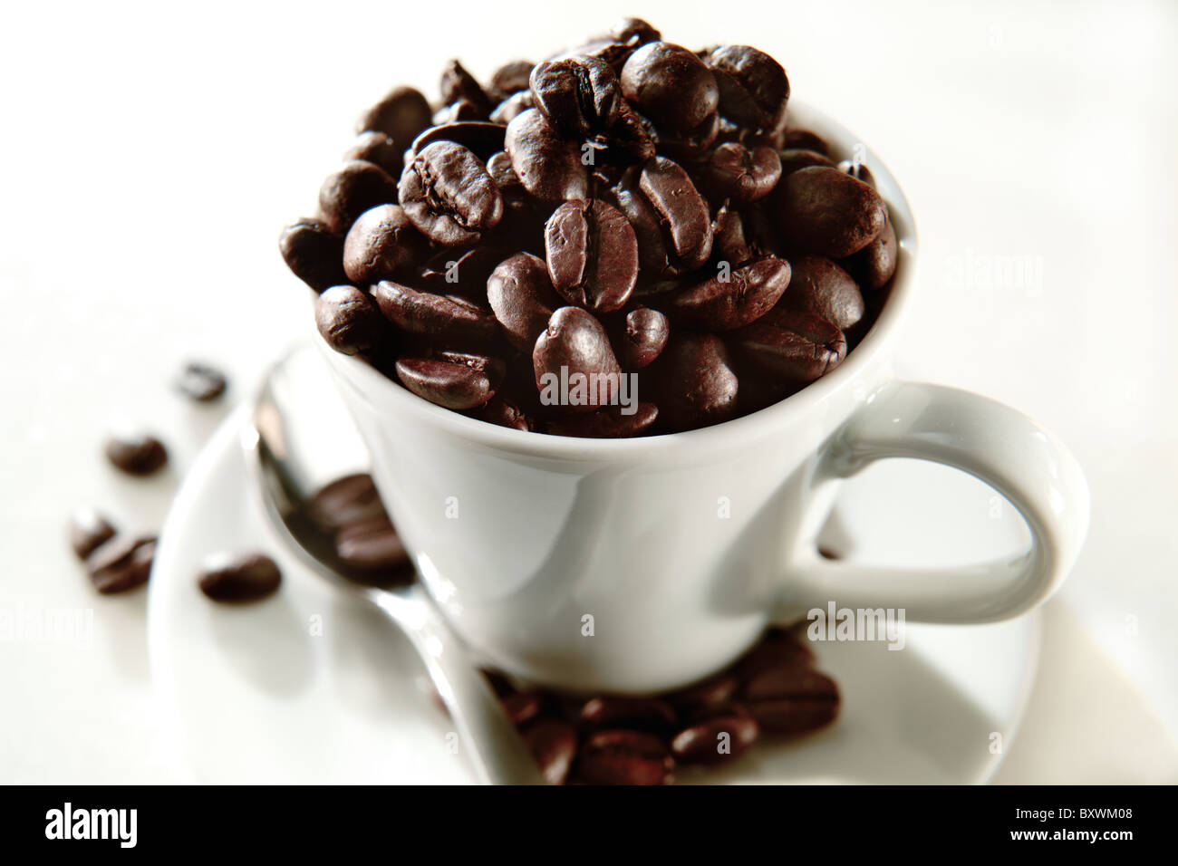 Fresh coffee beans in a coffee cup. Drink photos Stock Photo - Alamy