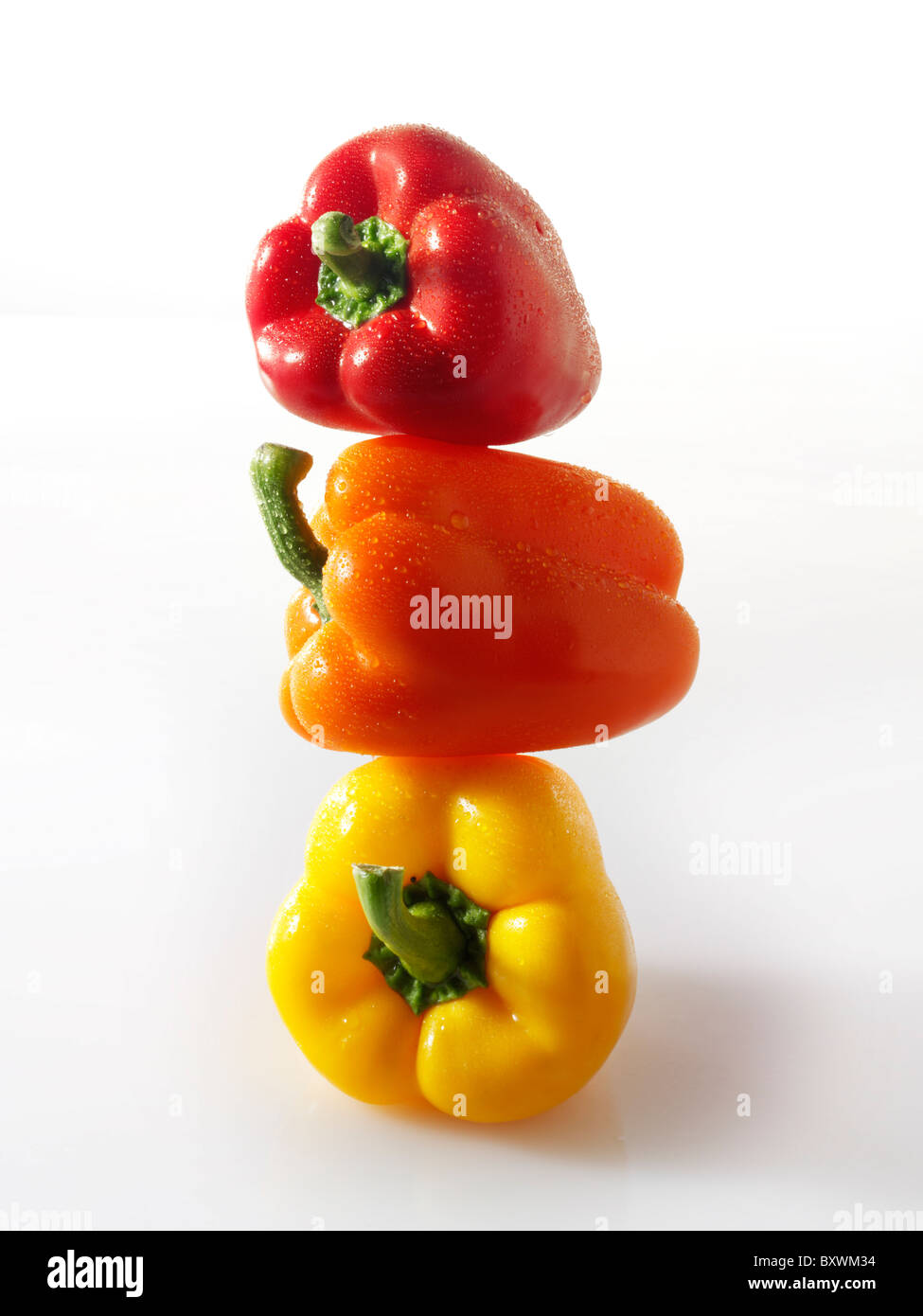 Mixed red, yellow & orange fresh bell peppers photos, pictures & images ...