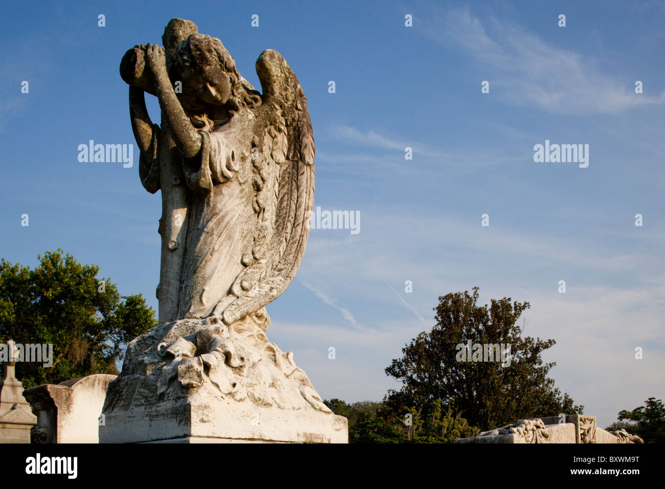 USA, Georgia, Savanna, Statue of grieving angel and cross in Catholic ...