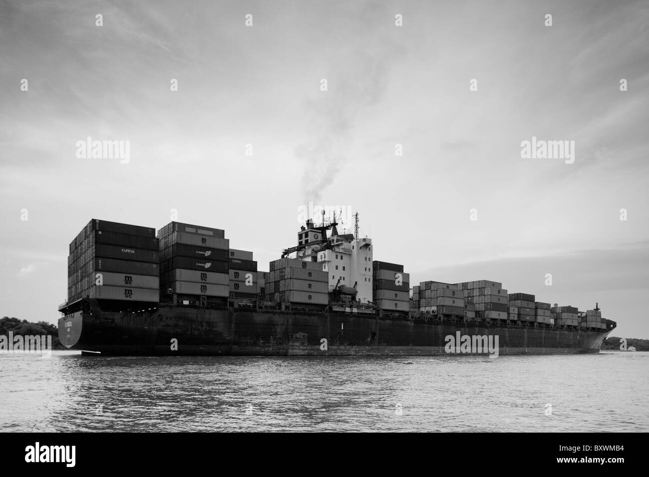 USA, Georgia, Savanna, Fully loaded cargo ship sailing up Savanna River ...