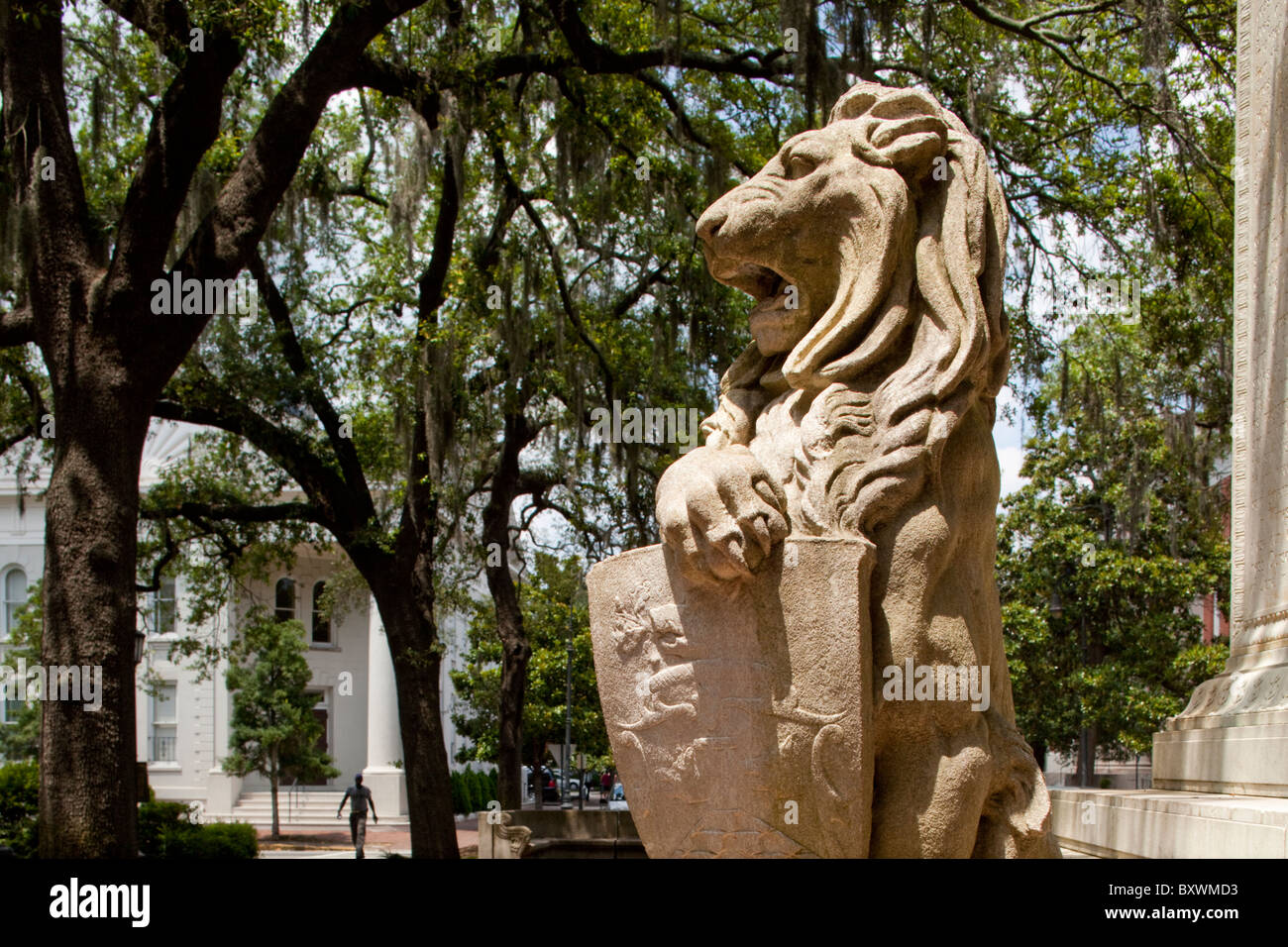 USA, Georgia, Savannah, Lion statue outside historic mansion along ...