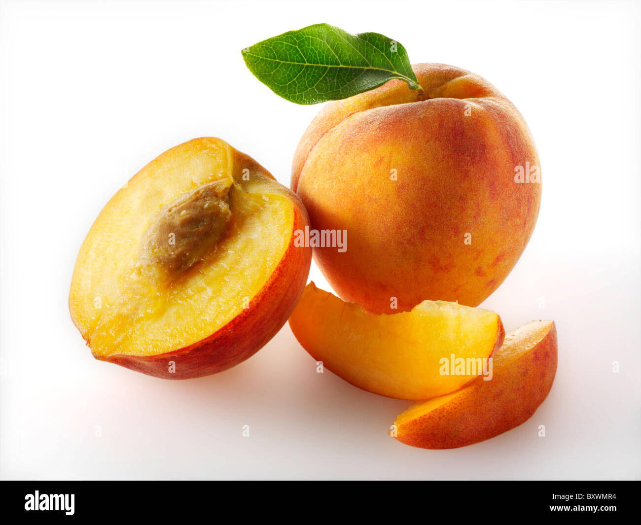 Fresh apricots whole and cut in halves Stock Photo - Alamy