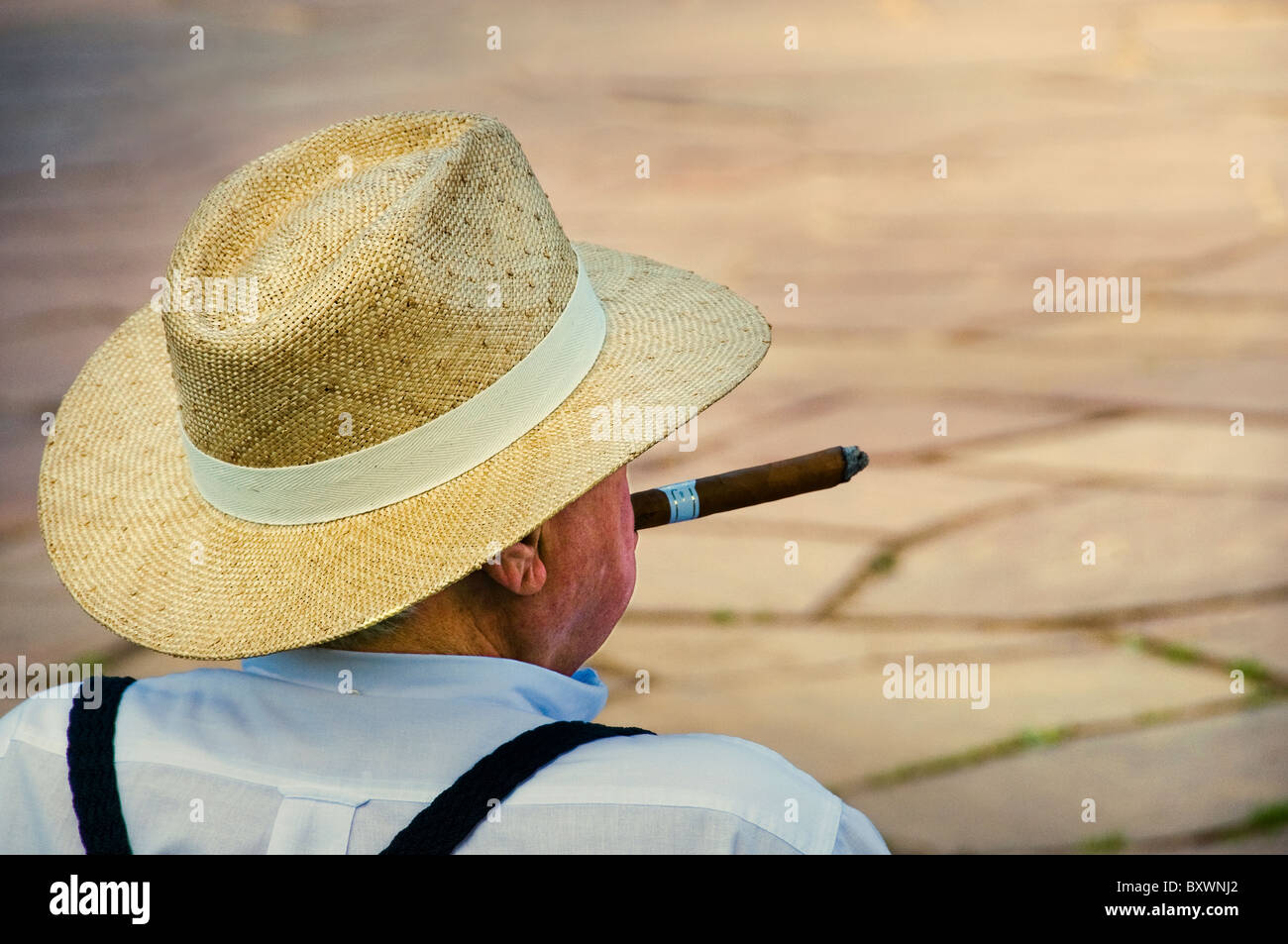 Elderly southern looking gentleman smoking a cigar in plaza in Santa Fe ...