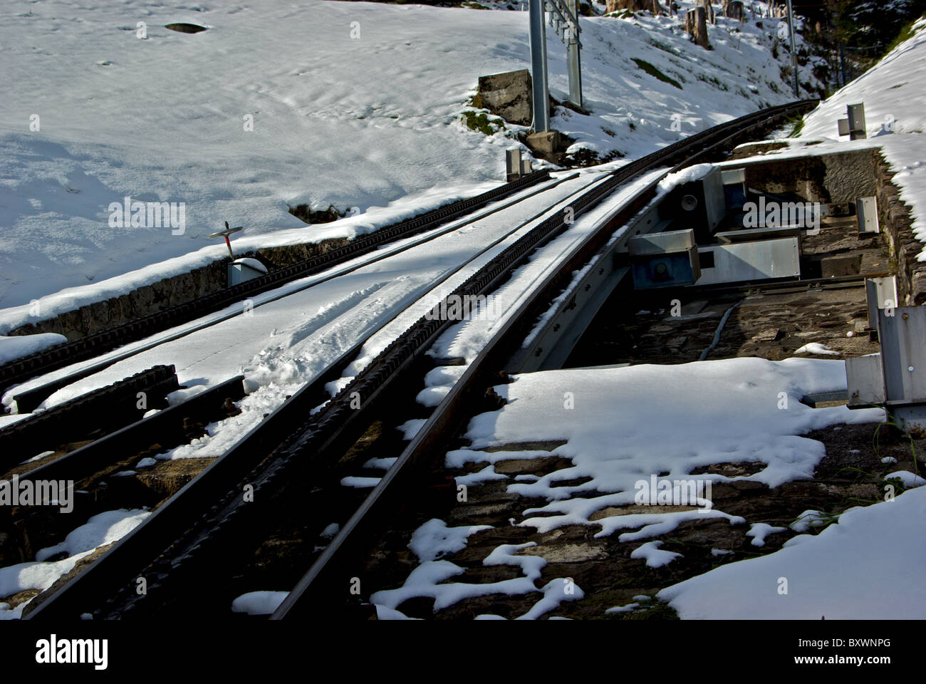 Snow covered hydraulic line switch railway tracks with third rack rail ...