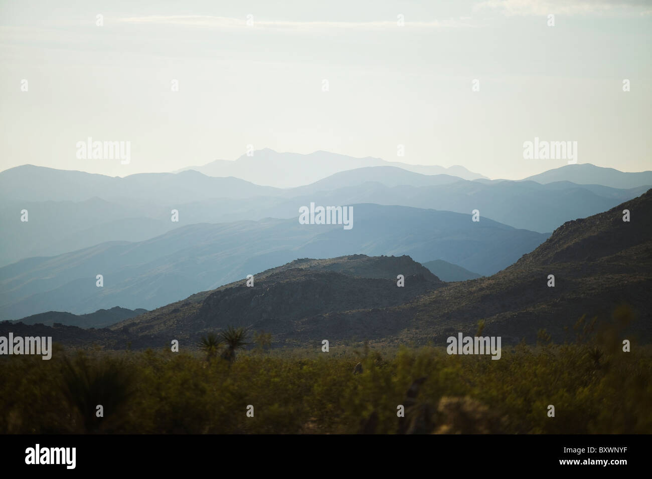 Layers of desert mountain ranges in morning fog - Mojave desert ...