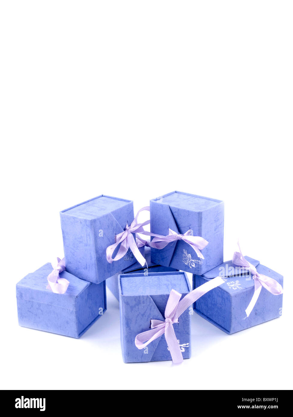 Six small lilac gift boxes on white background Stock Photo - Alamy