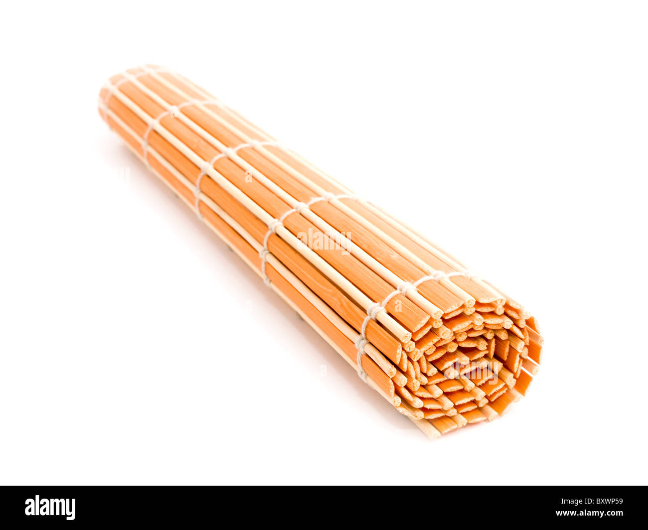 Rolled orange bamboo mat on white background Stock Photo - Alamy