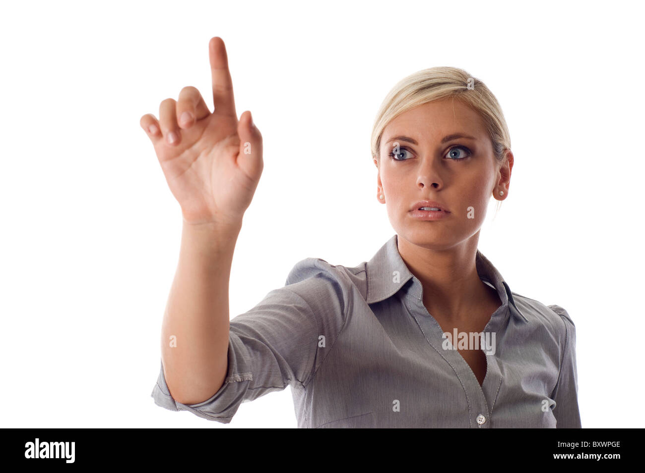 Confident business woman pointing at the screen isolated over white ...