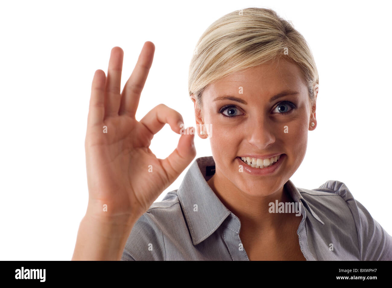 Smiling business woman showing okay sign isolated over a white background Stock Photo - Alamy