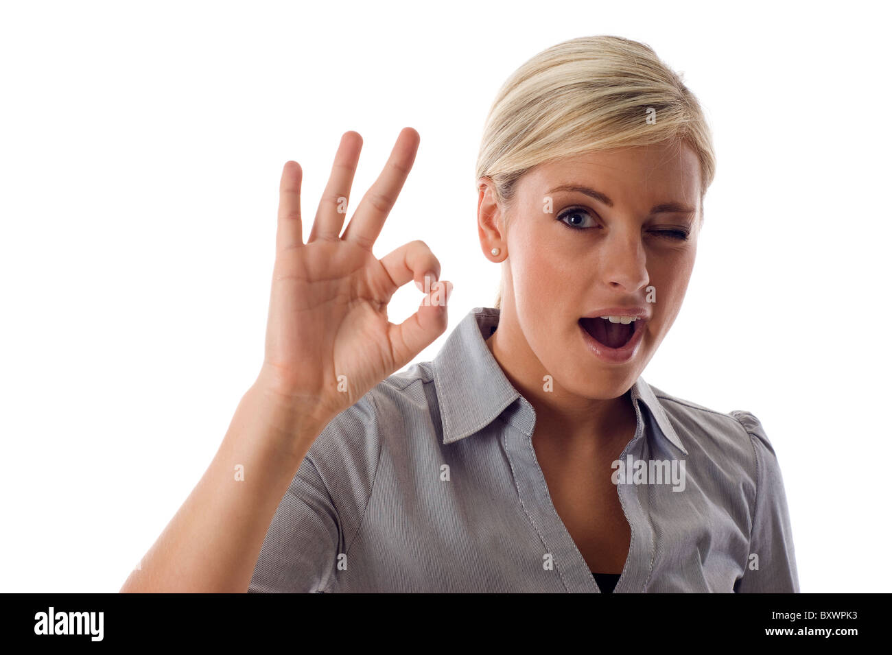 Smiling business woman showing okay sign isolated over a white background Stock Photo - Alamy