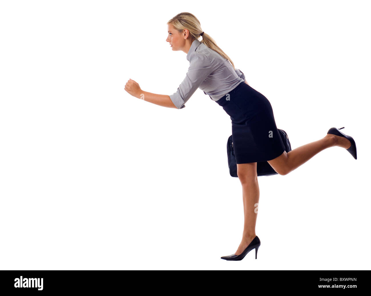 Determined business woman holding a suitcase and running on isolated ...