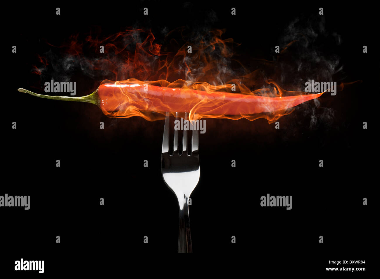 a red chili pepper on the fork Stock Photo - Alamy