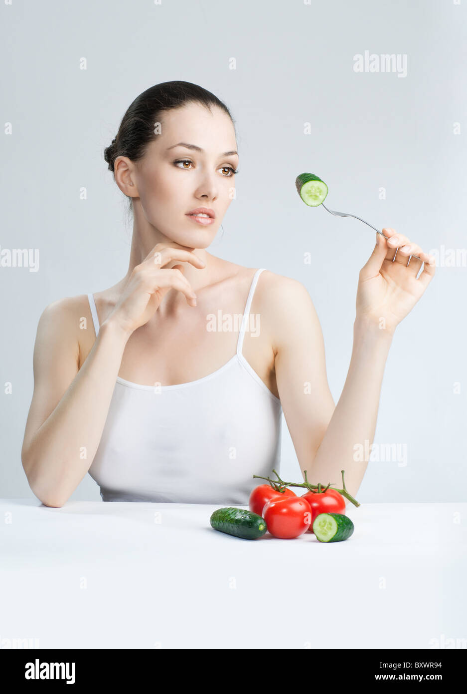 A beautiful slender girl eating healthy food Stock Photo - Alamy