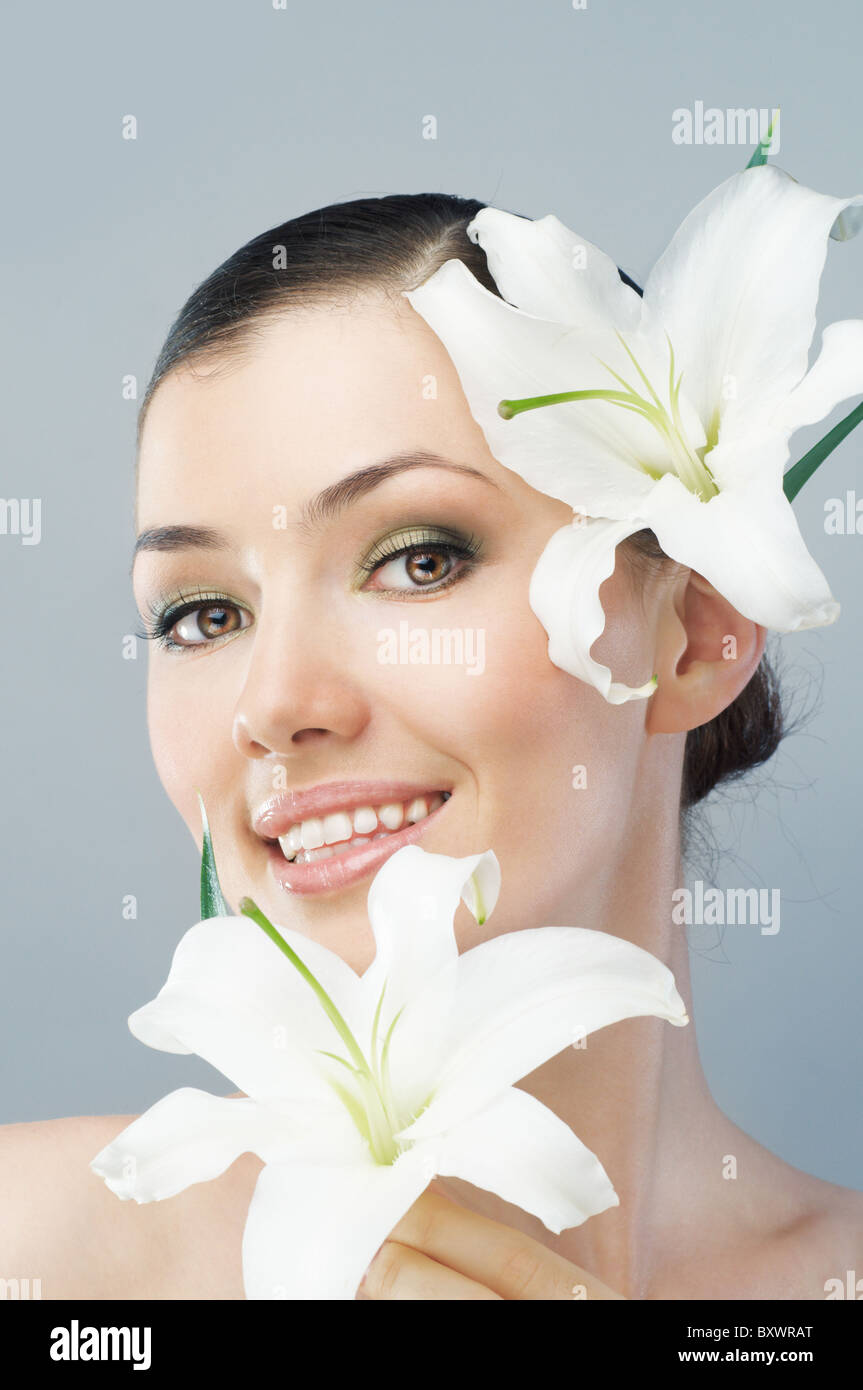 beauty flower girl on the blue background Stock Photo - Alamy