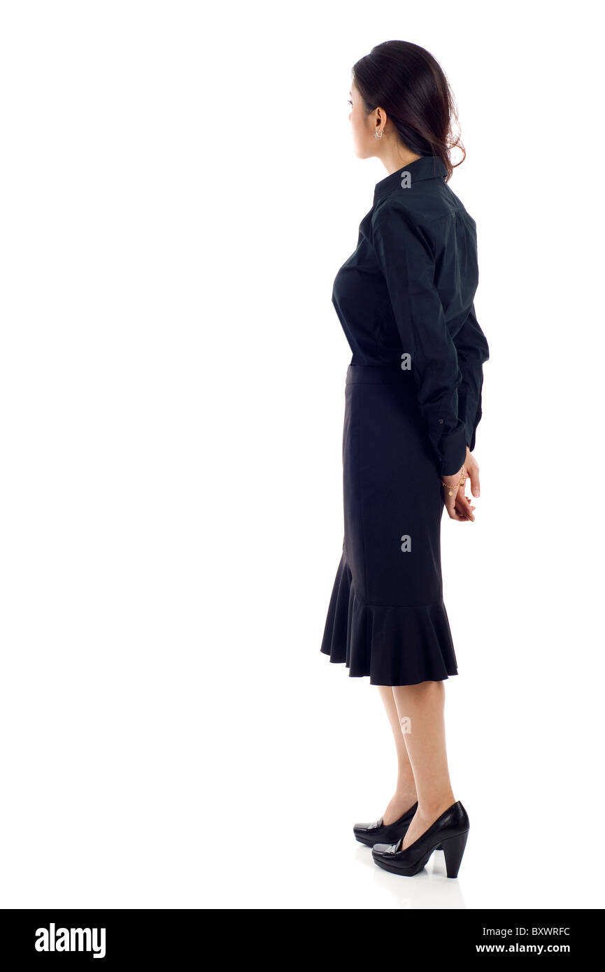 Asian business woman from the back - looking at something over a white ...