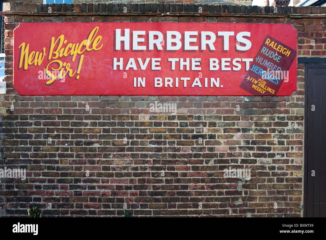 hand painted sign for a cycle shop Stock Photo - Alamy