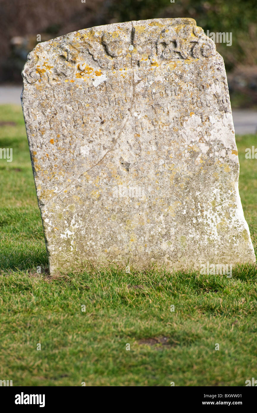 old eroded grave stone Stock Photo - Alamy