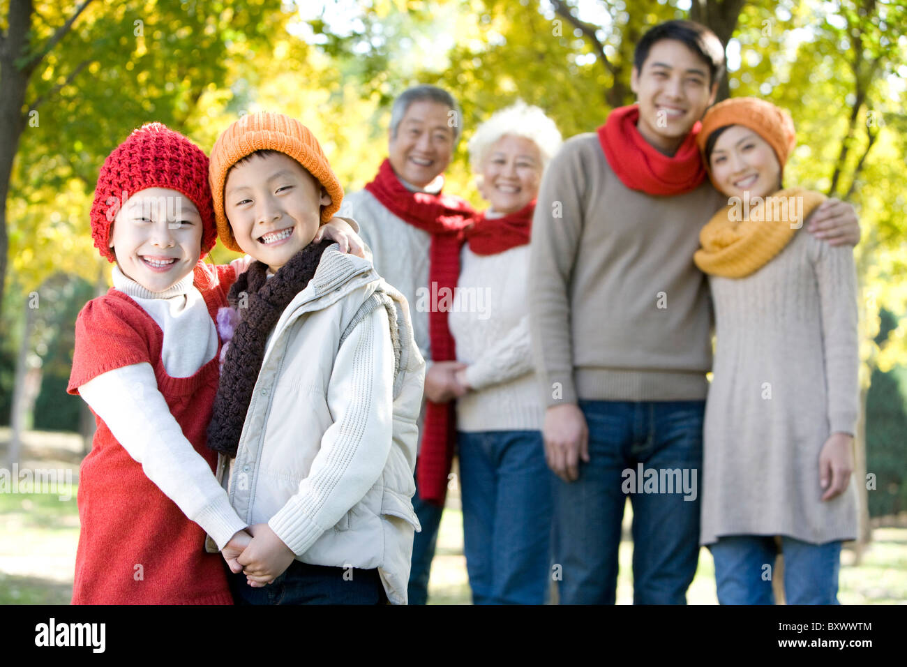 Three Generation Family Enjoying a Park in Autumn Stock Photo - Alamy