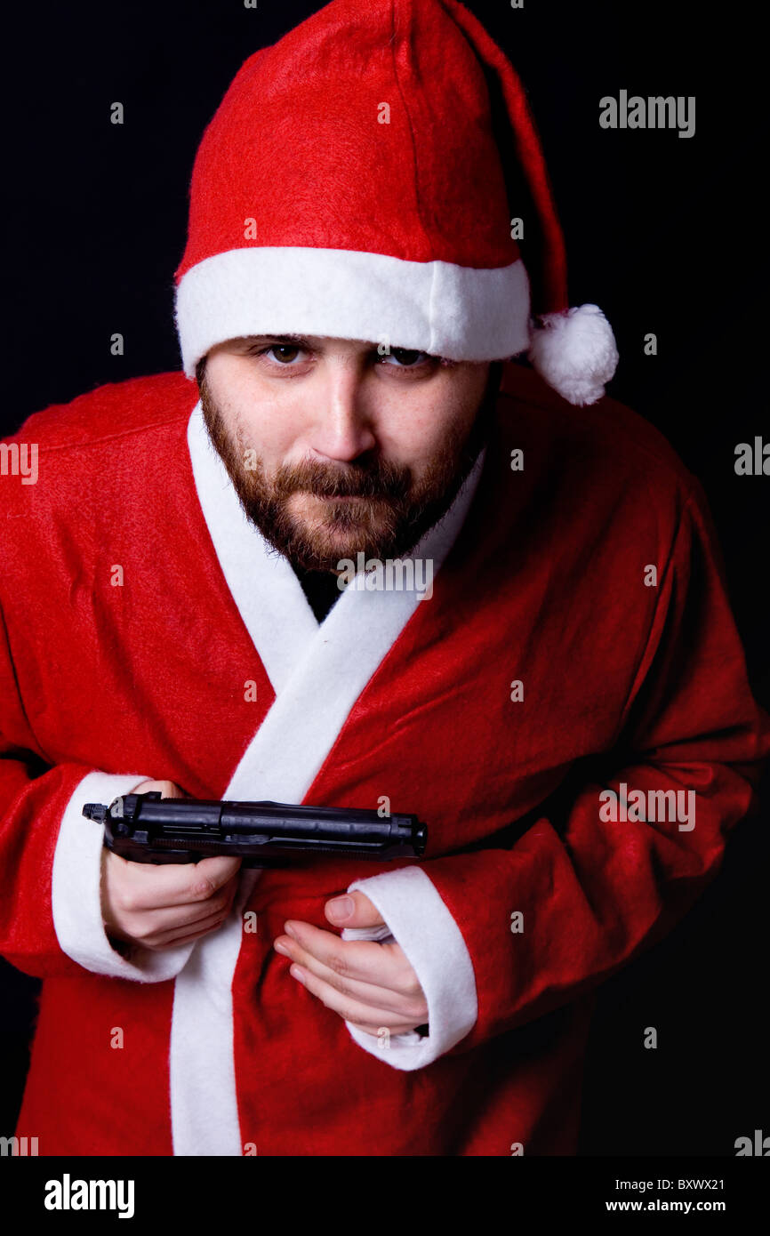 Santa with gun hi-res stock photography and images - Alamy