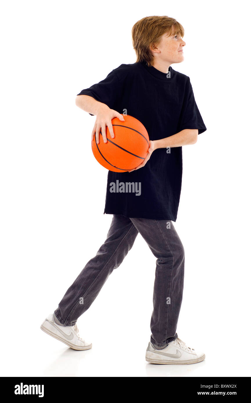 Young boy dunking a basketball isolated on white background Stock Photo ...