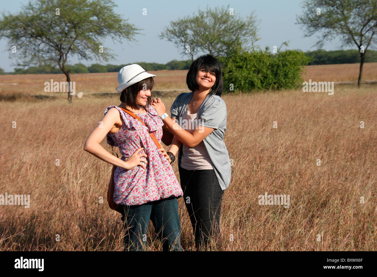 Two Indian girls smiling Stock Photo - Alamy