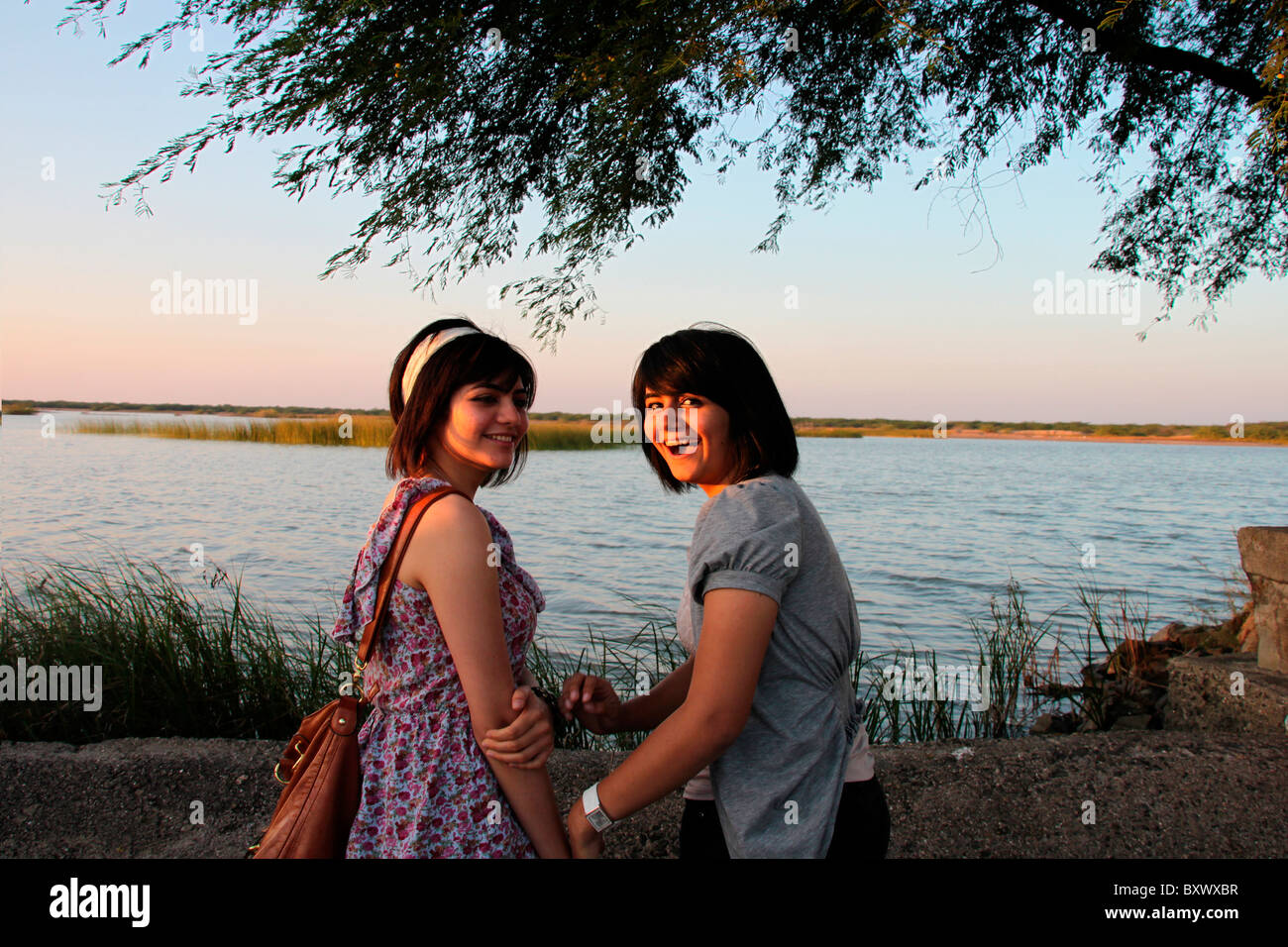 Two girls sharing light moments Stock Photo - Alamy