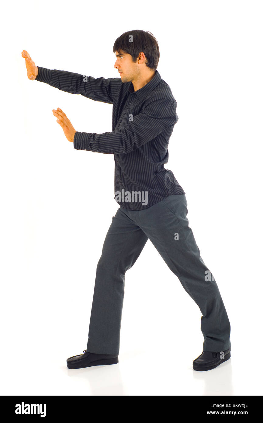 Business man pushing something imaginary isolated on white Stock Photo ...