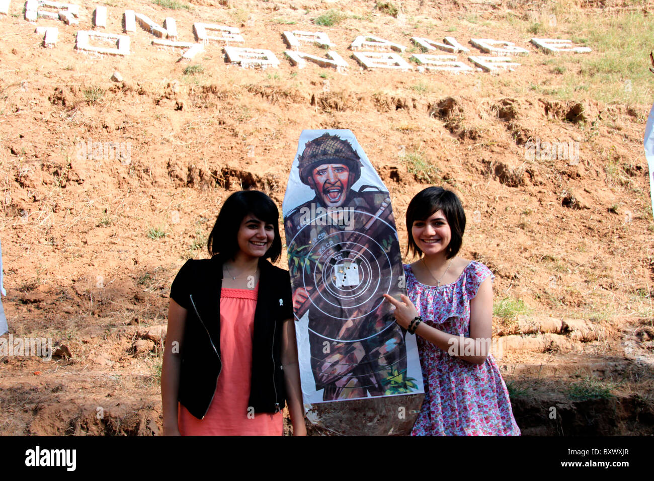 Two Indian girls posing with a shooting target Stock Photo - Alamy