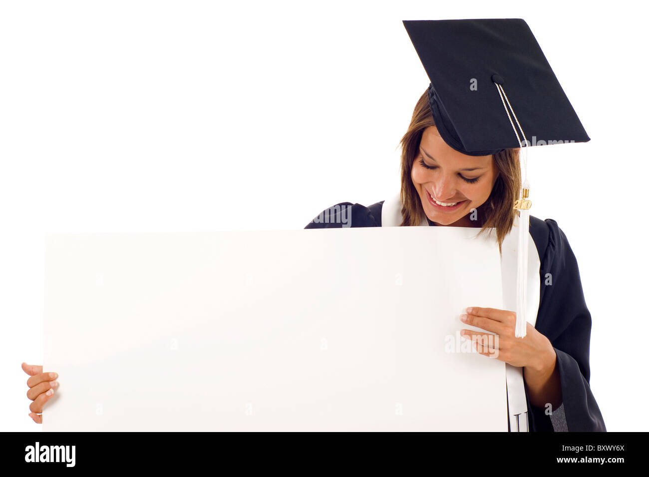 Friendly smiling graduation woman holding and looking at the banner ...