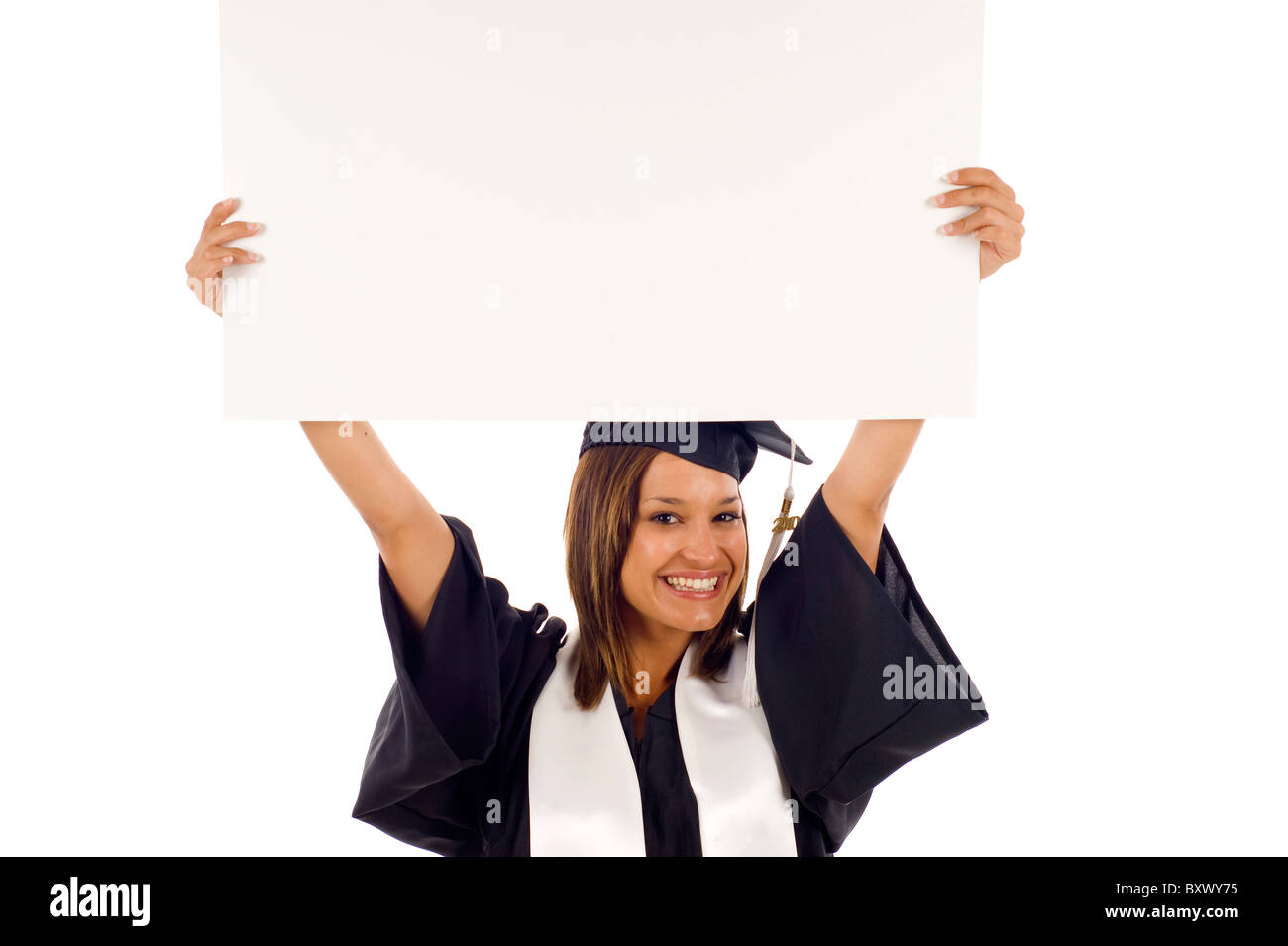 Friendly smiling graduation woman with a banner isolated over a white ...
