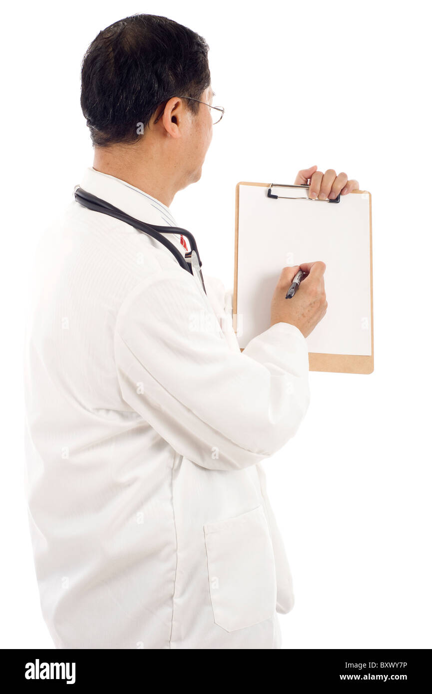 Back view of an Asian doctor writing something on a blank clipboard ...