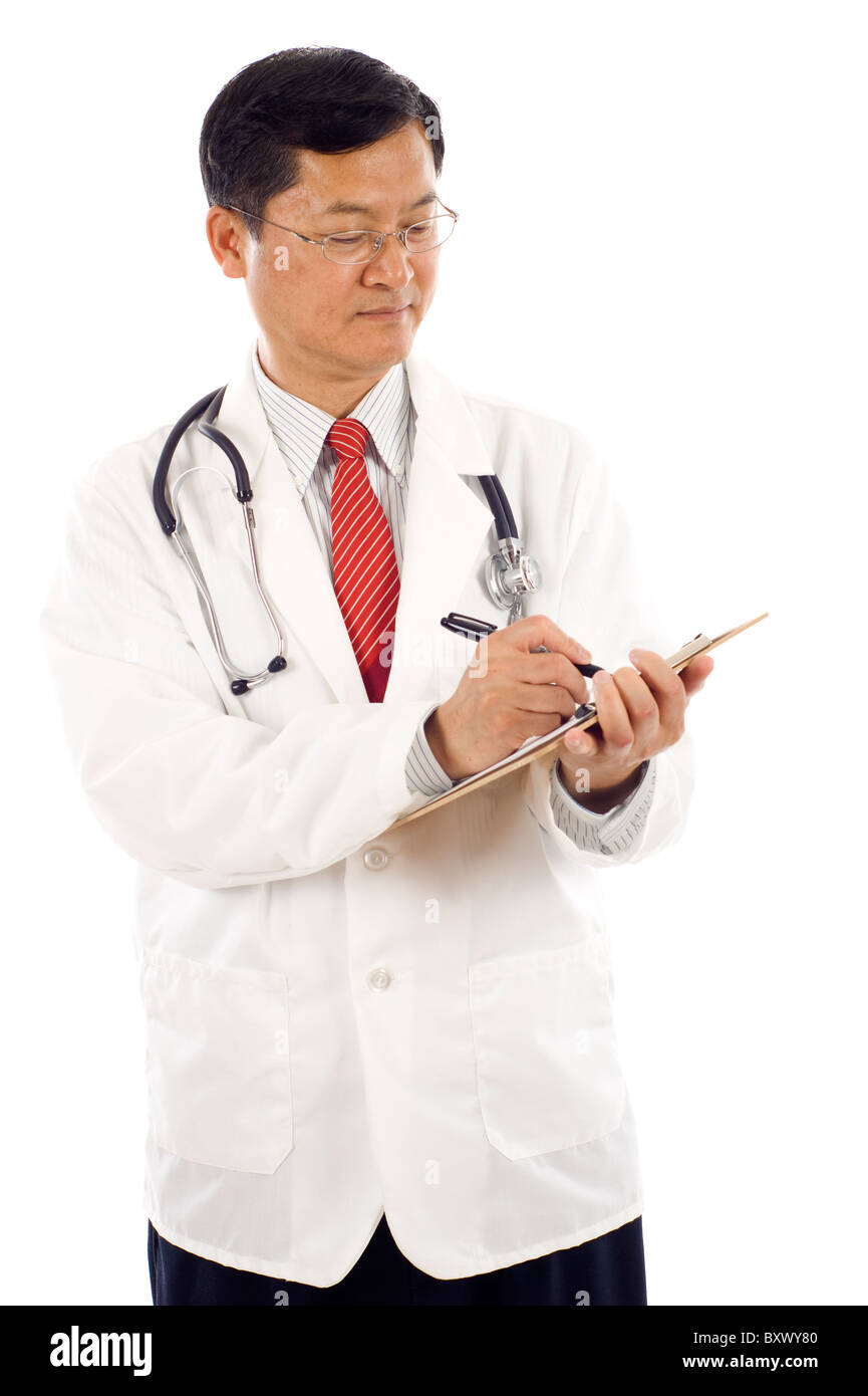 Portrait of a senior Asian American doctor writing reports isolated on ...