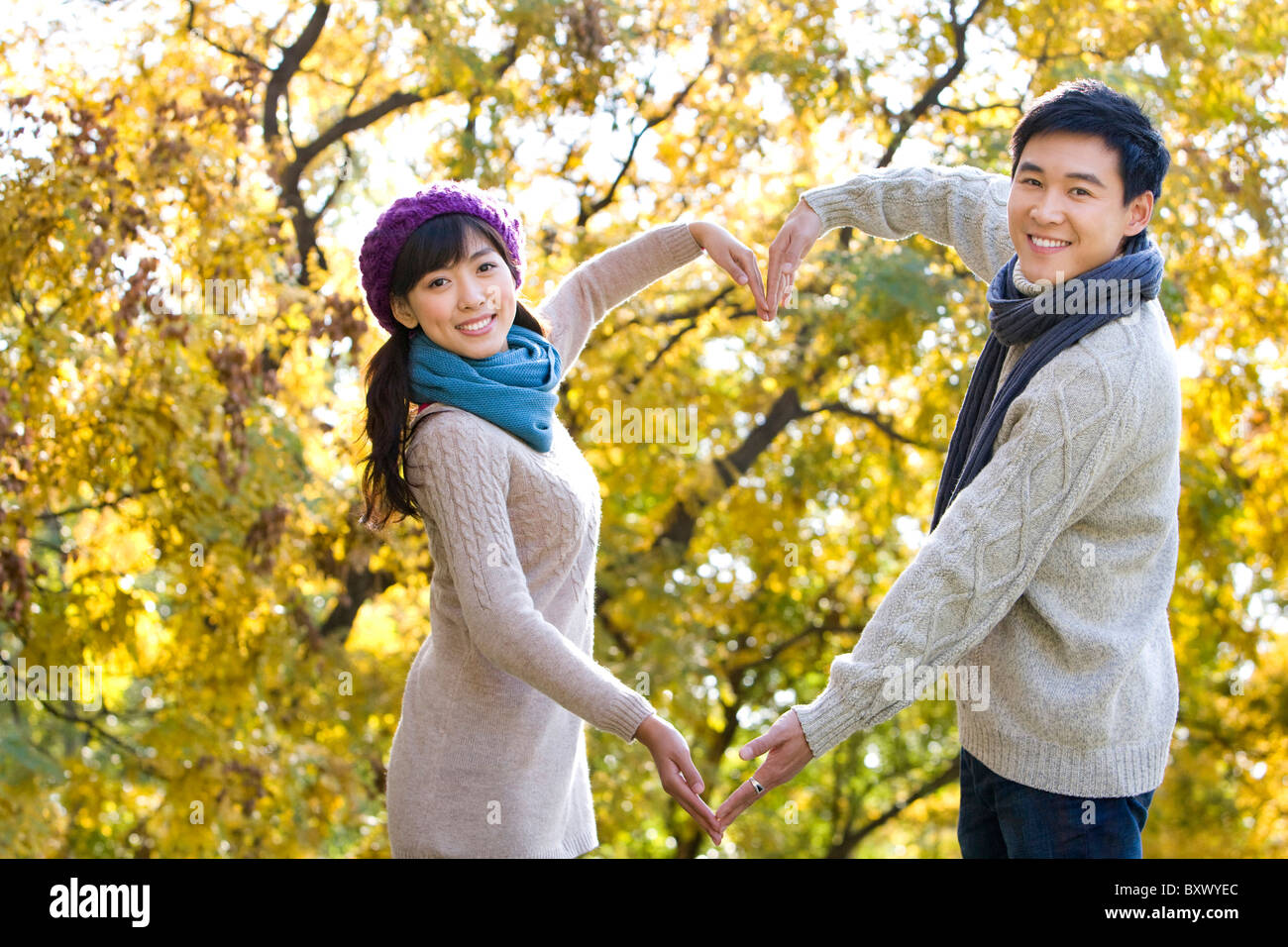Couple Making Heart Shape Arms High Resolution Stock Photography and ...