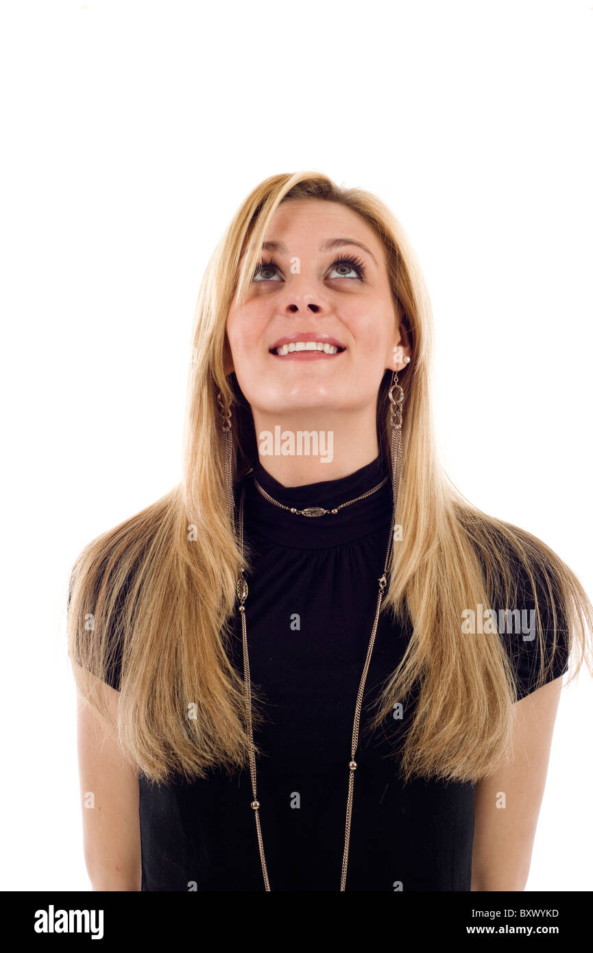 Young smiling business woman looking up above. Isolated over a white ...