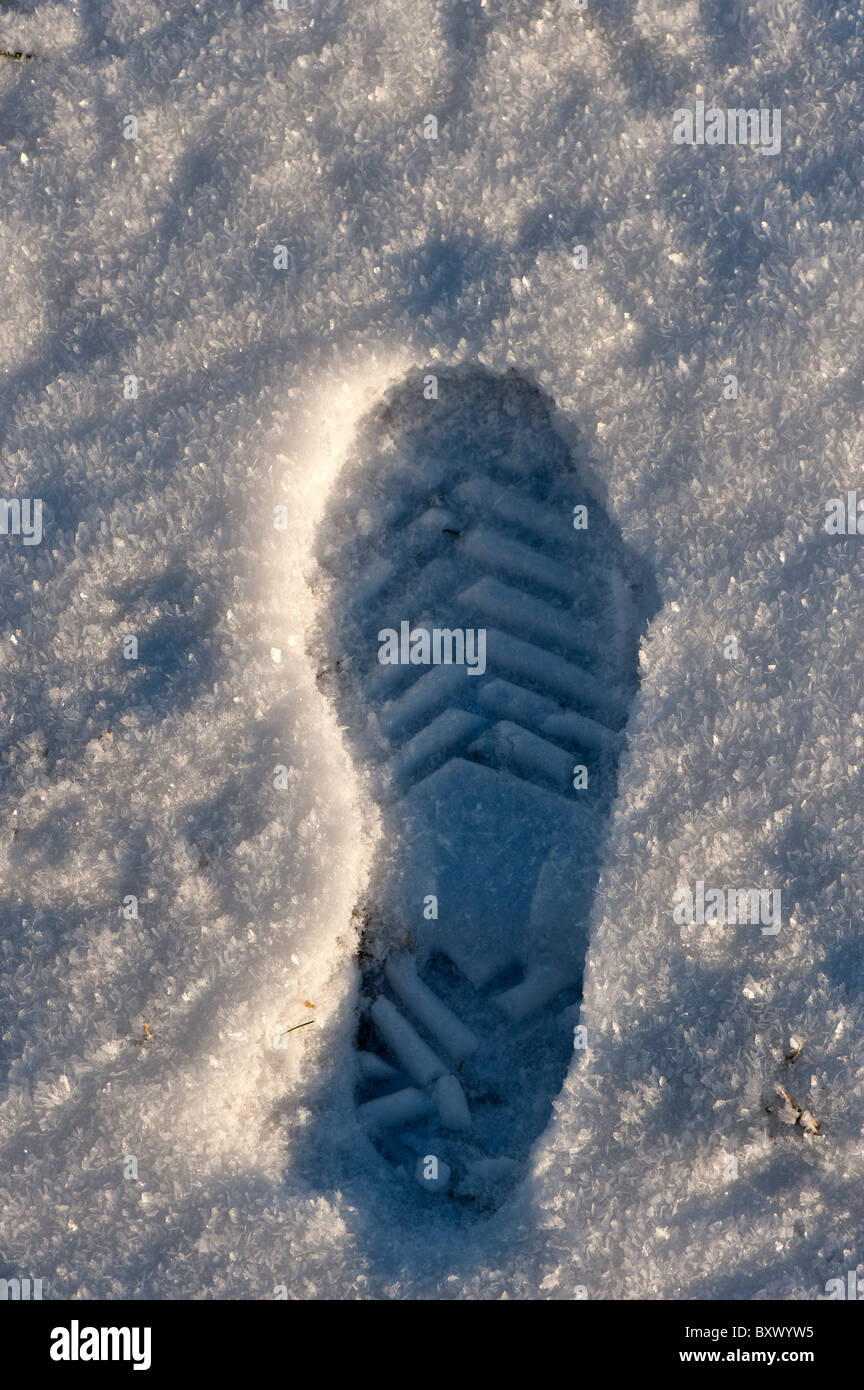 Shoe footprint in snow, showing strong tread for good grip Stock Photo ...