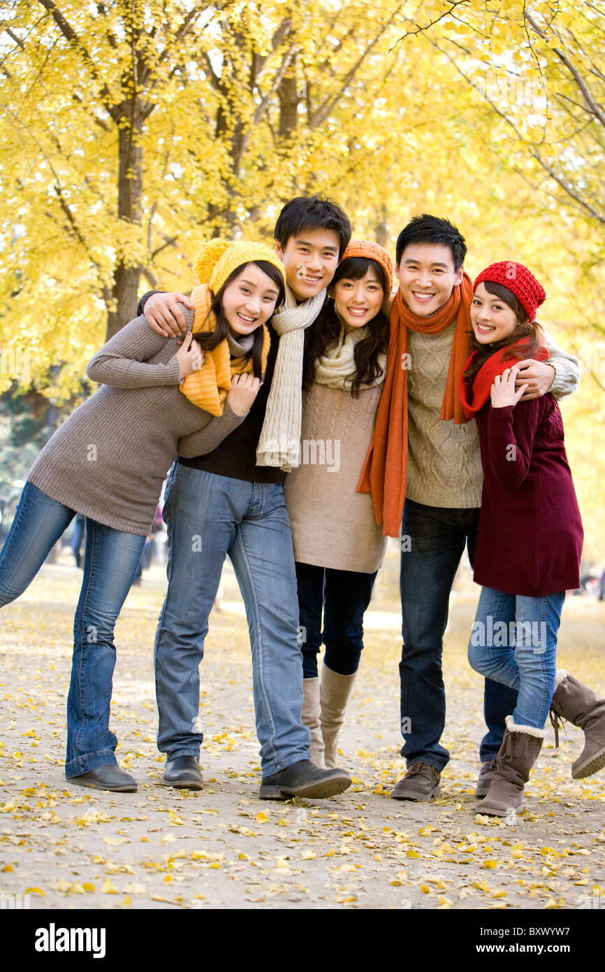 Friends Enjoying a Park Together in Autumn Stock Photo - Alamy