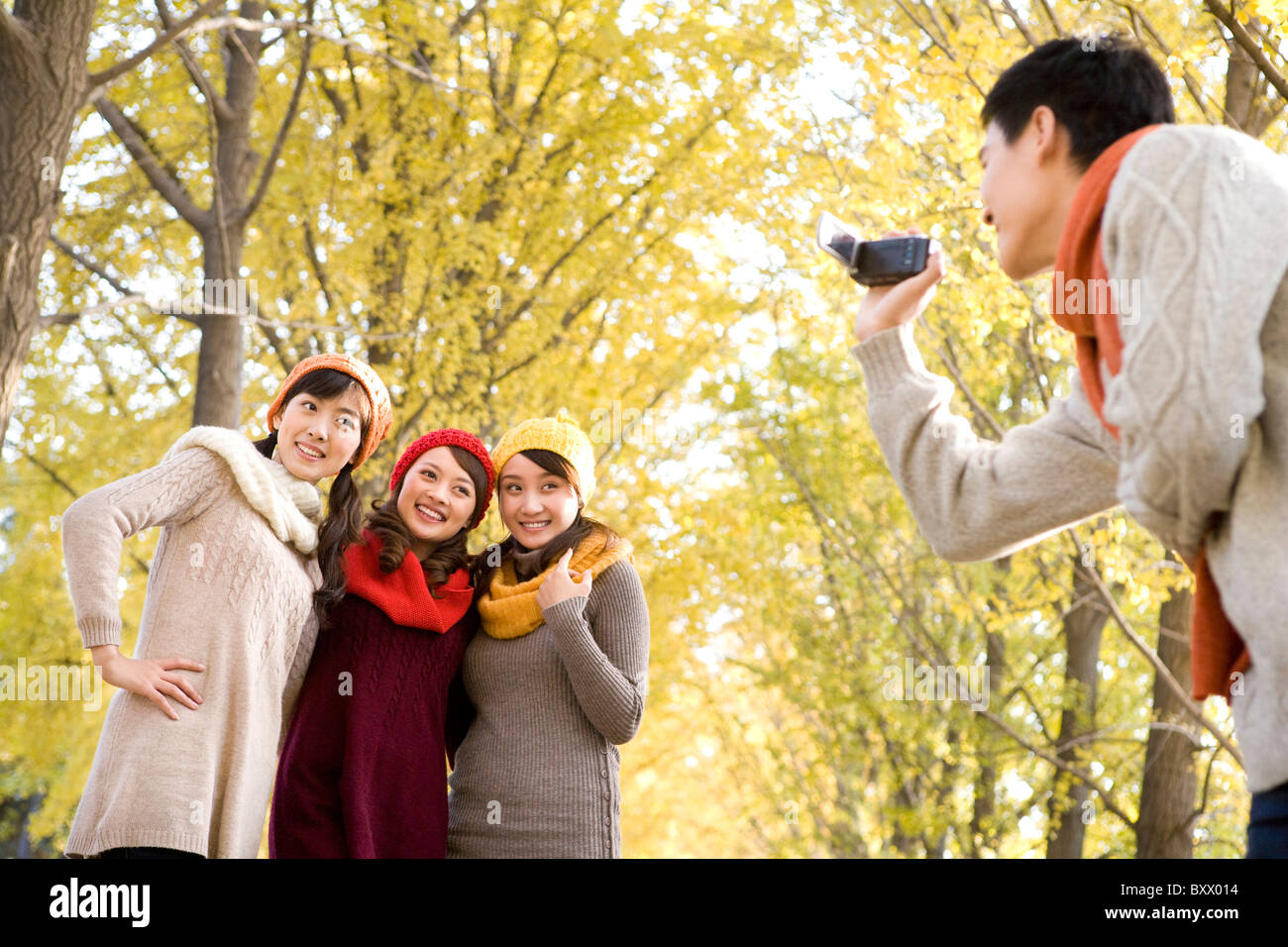 Young Man Filming 3 Friends with a Home Video Camera Stock Photo - Alamy