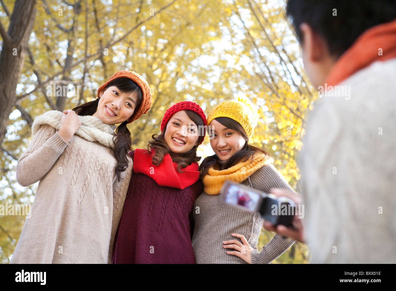 Young Man Filming 3 Friends with a Home Video Camera Stock Photo - Alamy