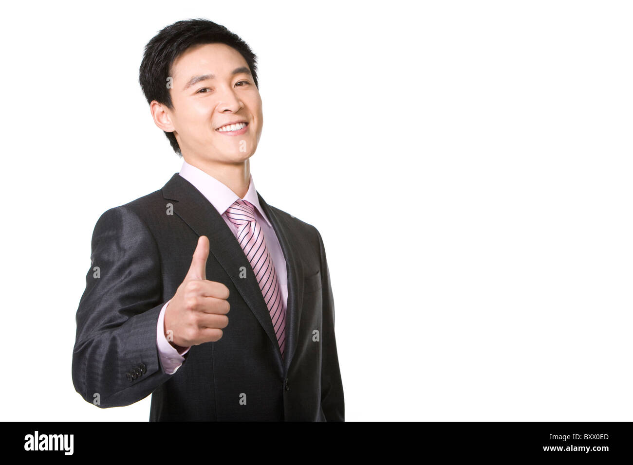 Businessman thumbs up Stock Photo - Alamy