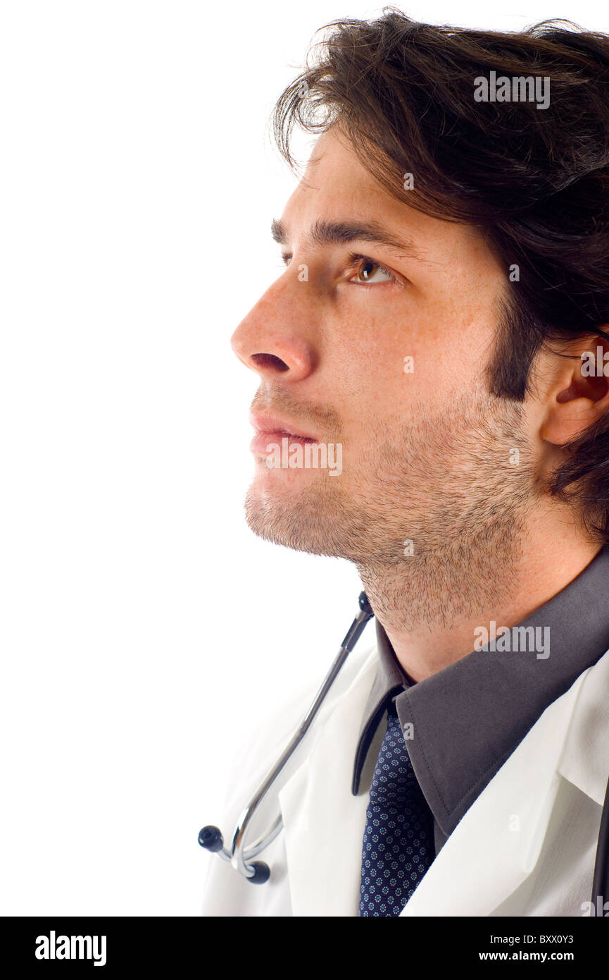 Closeup of young medical doctor in deep thought, Isolated over a white ...