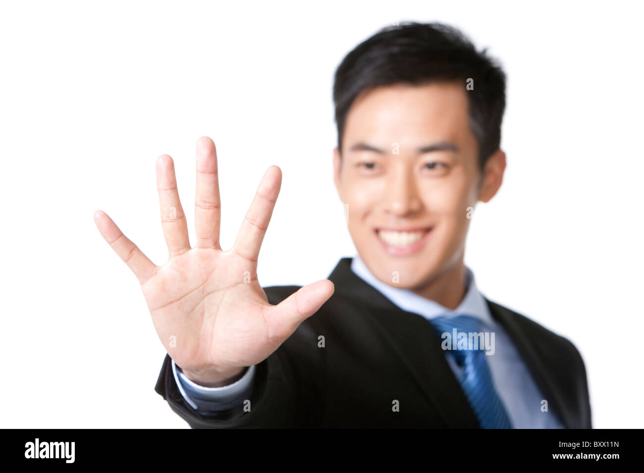 Businessman holding hand out in front Stock Photo - Alamy