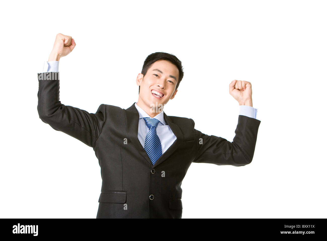 Businessman arms raised in celebration Stock Photo - Alamy