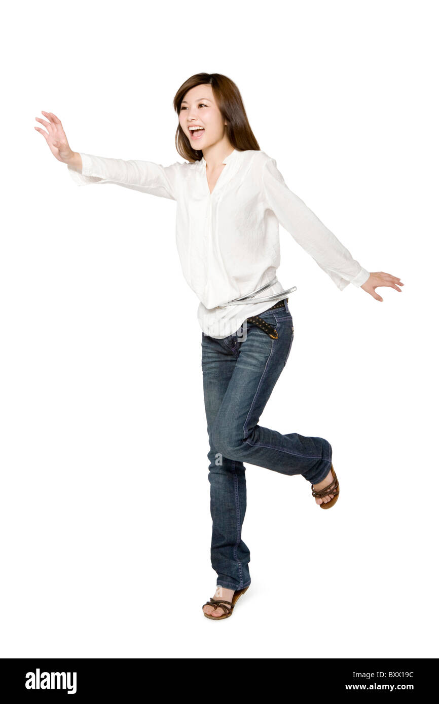 Portrait of Young Woman Reaching Stock Photo - Alamy