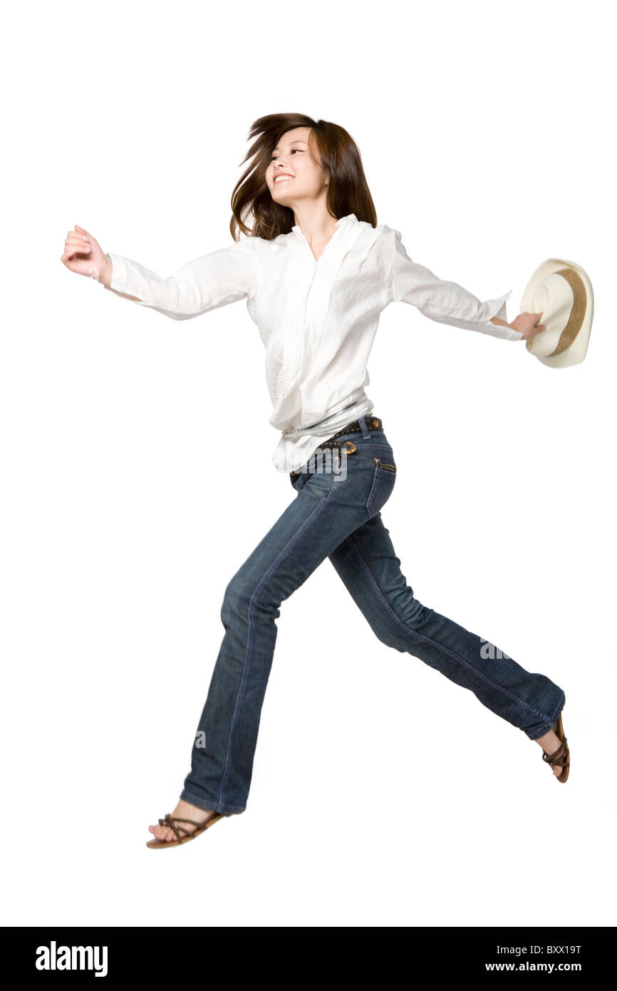 Portrait of Young Woman Jumping Stock Photo - Alamy
