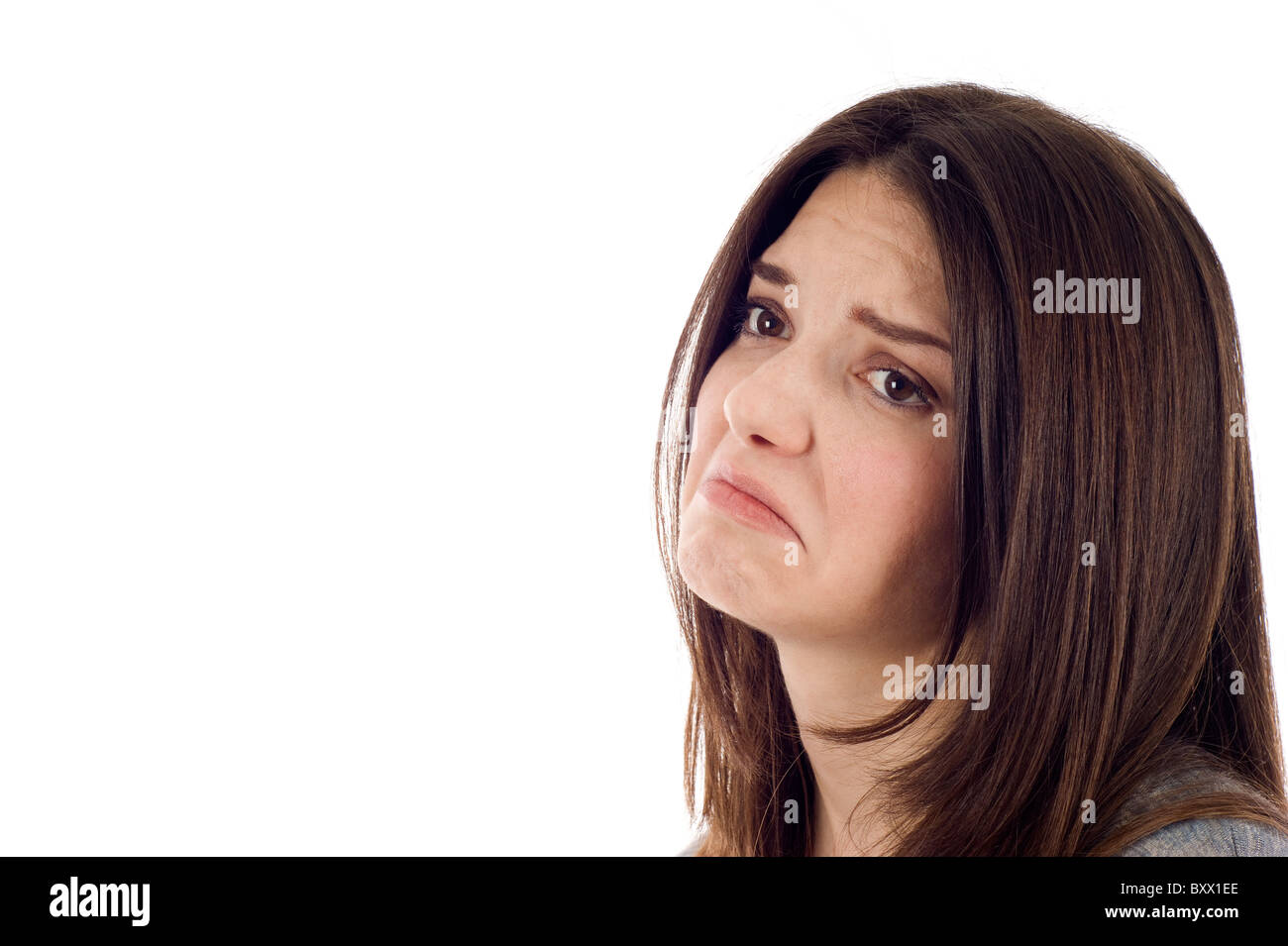 Side view of a sad woman isolated over white background, a lot of ...