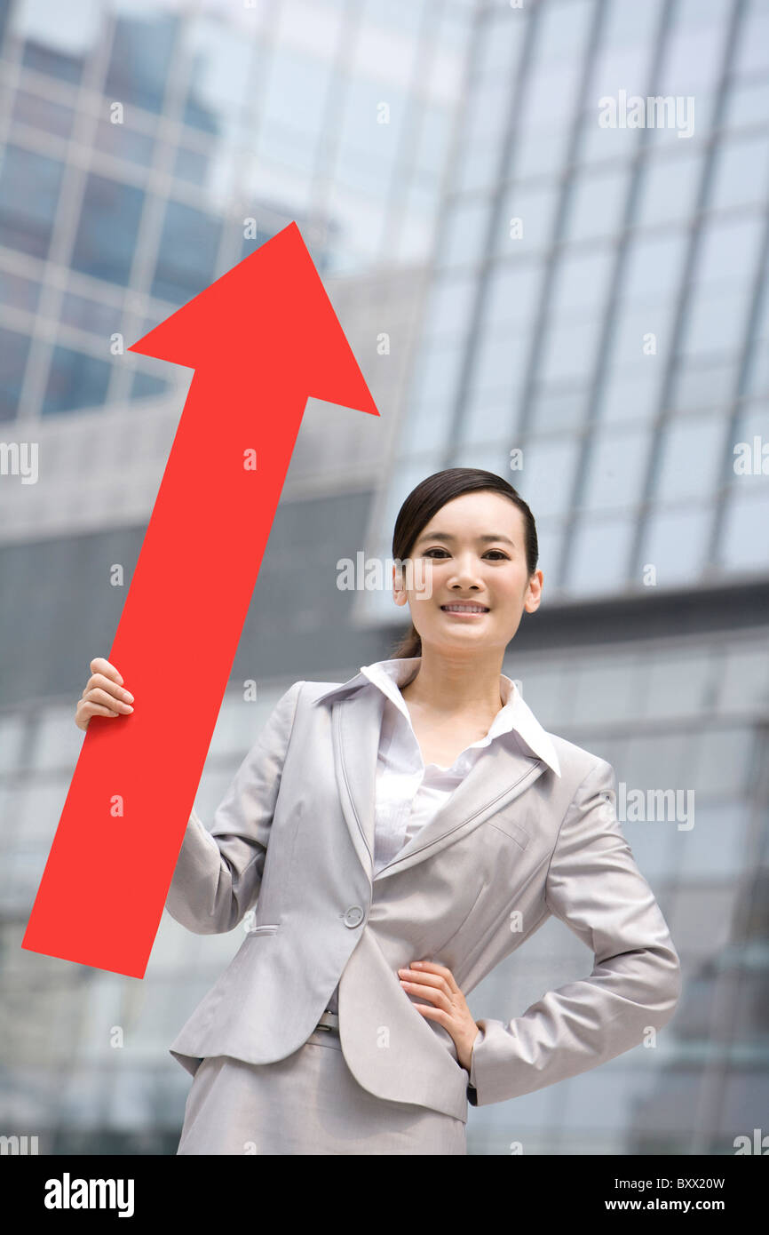 Chinese businesswoman with a red arrow Stock Photo - Alamy
